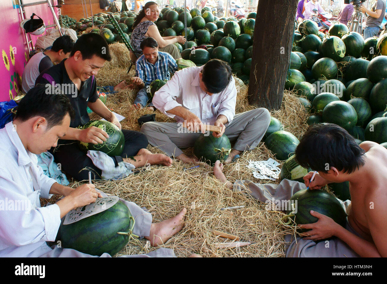 HO CHI MINH CITY, VIET NAM, Group of Asian man working on pavement of ...