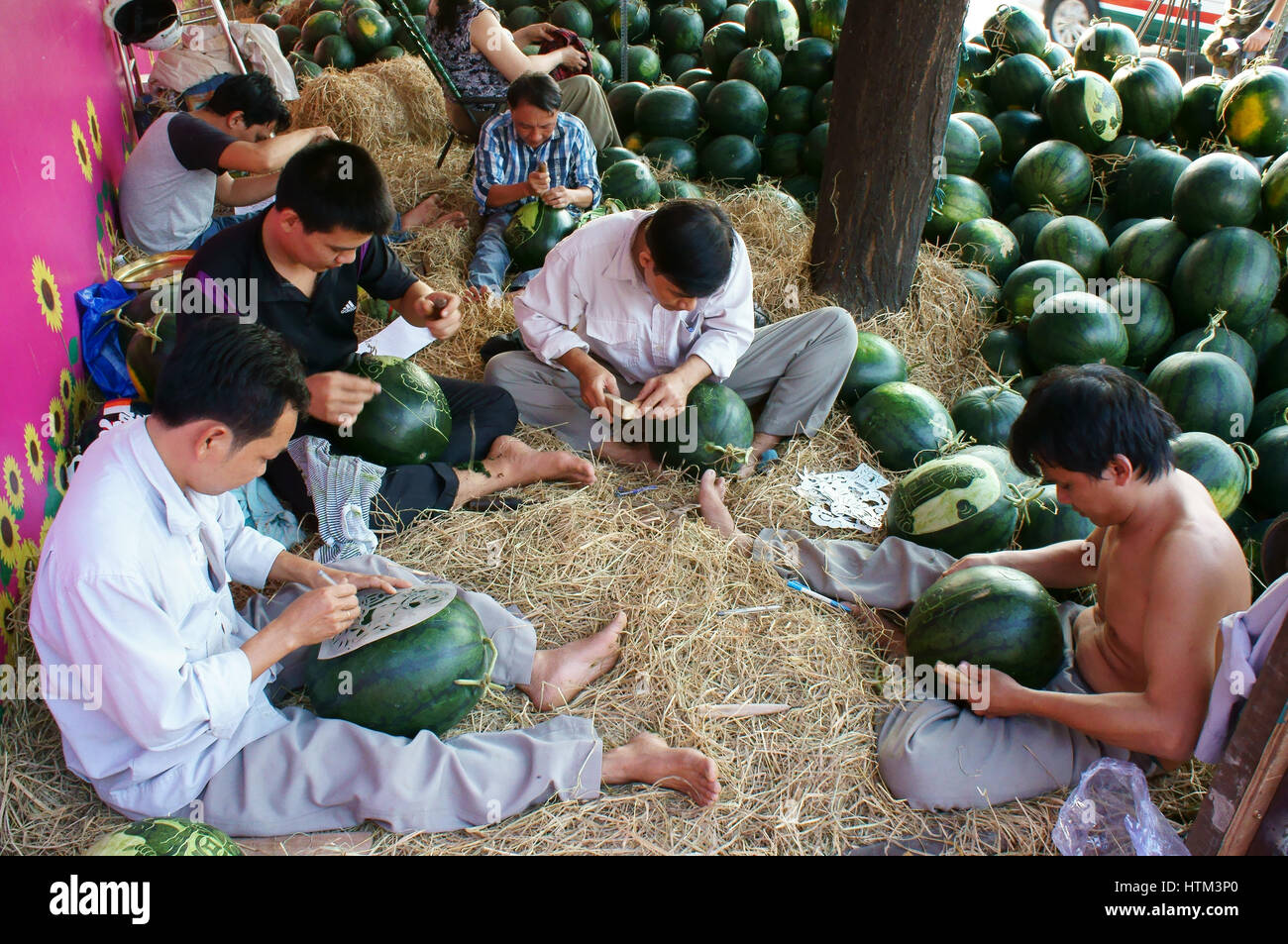 HO CHI MINH CITY, VIET NAM, Group of Asian man working on pavement of ...