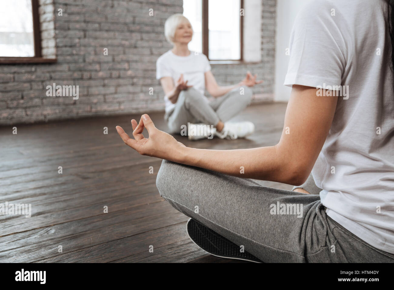 Female coach sitting on the front ground Stock Photo - Alamy