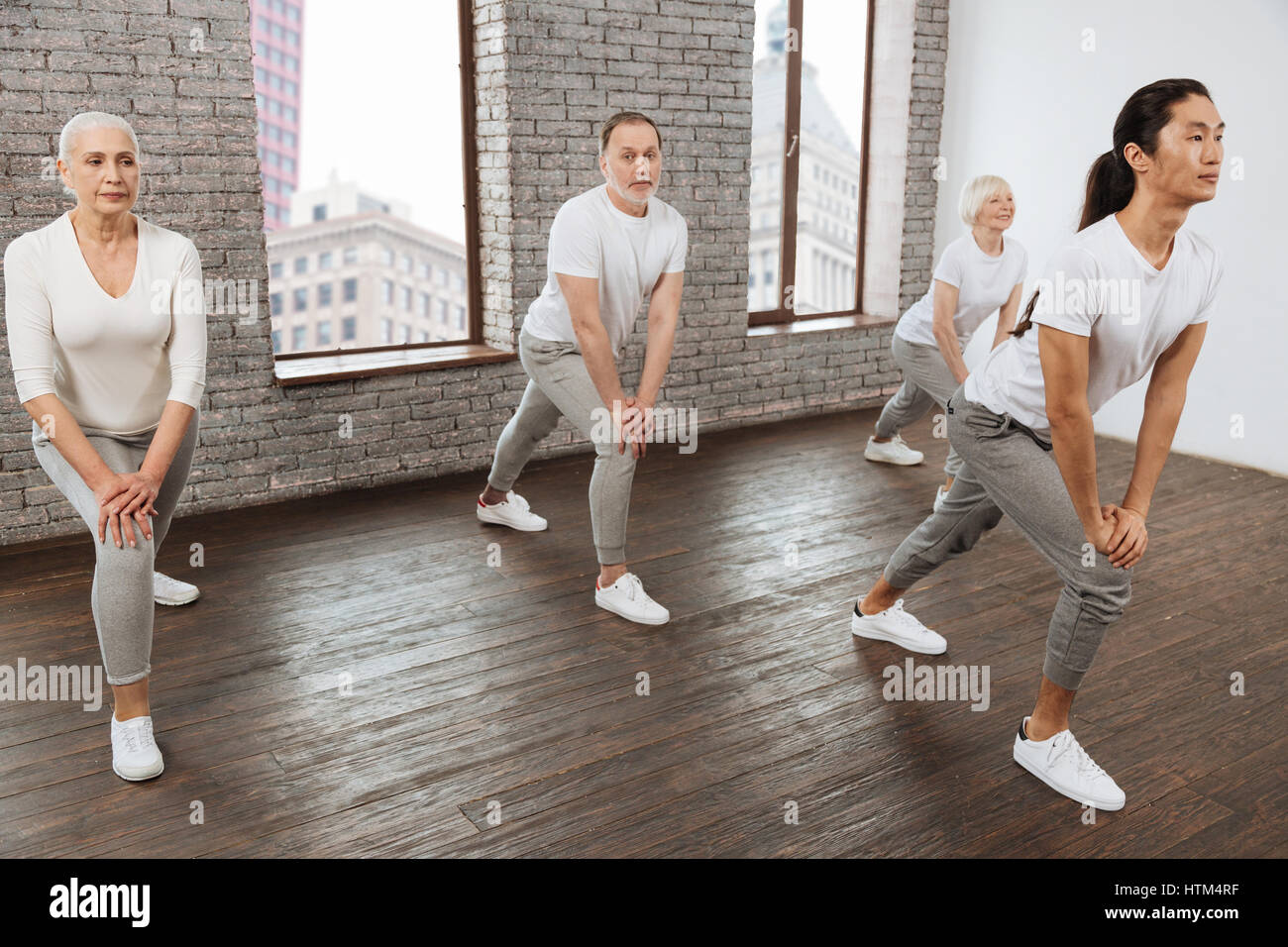 Group of healthy people lunging forward Stock Photo - Alamy