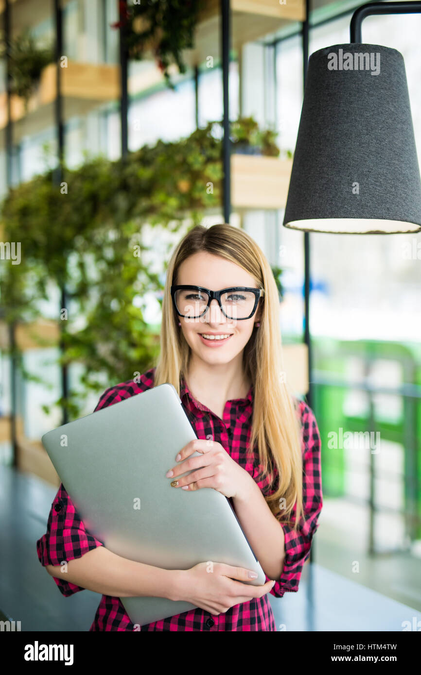 Beautiful business freelance lady in smart casual wear with laptop in ...