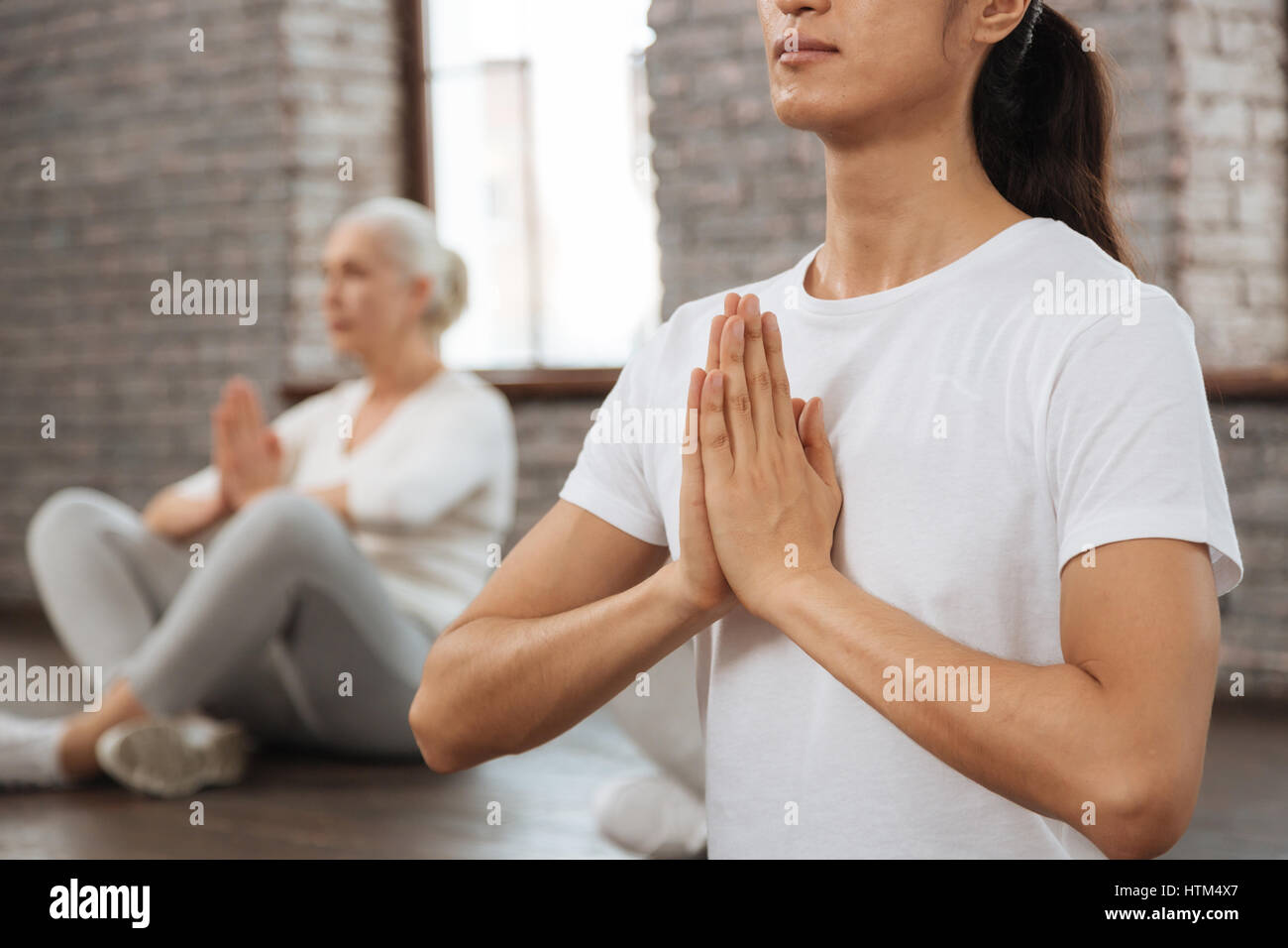 Hands on chest pose hi-res stock photography and images - Alamy