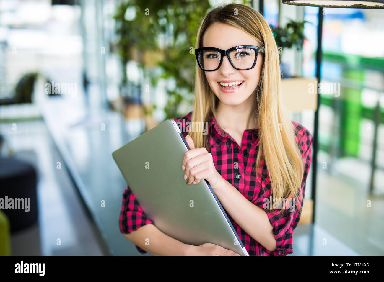 Beautiful business freelance lady in smart casual wear with laptop in ...