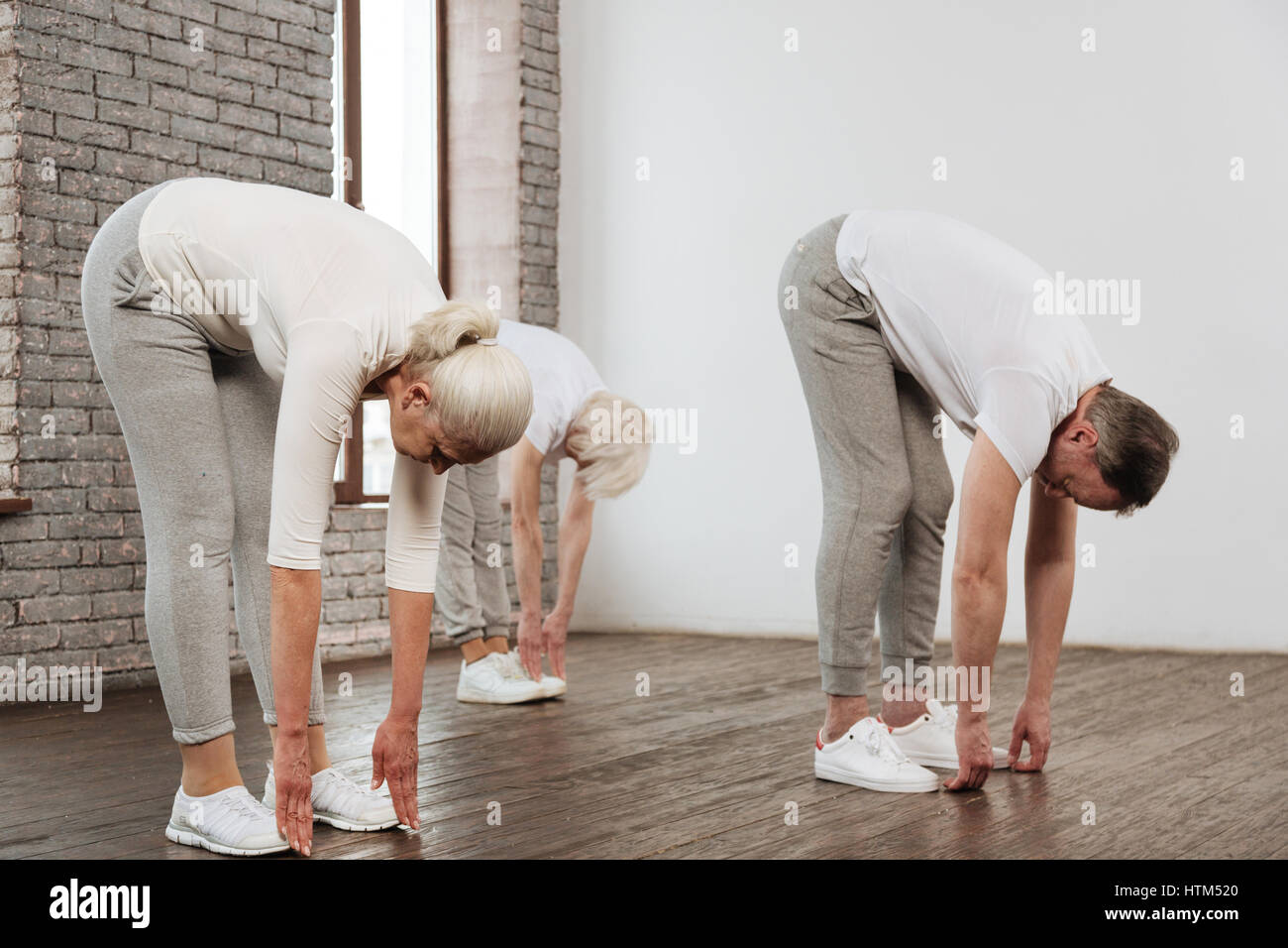 Stooping figure hi-res stock photography and images - Alamy