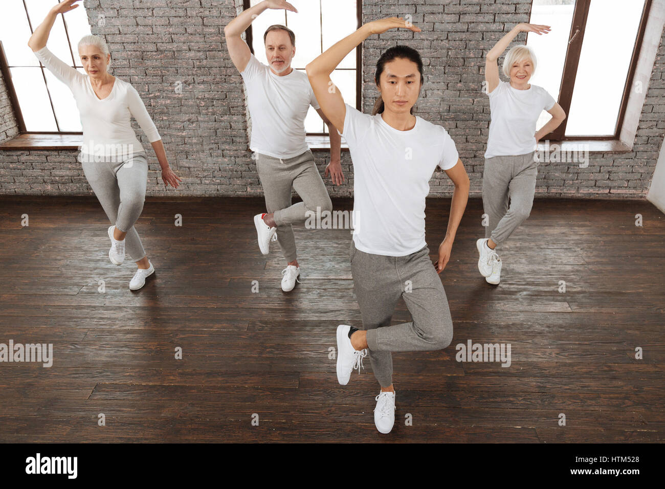 Group of healthy people holding balance Stock Photo - Alamy