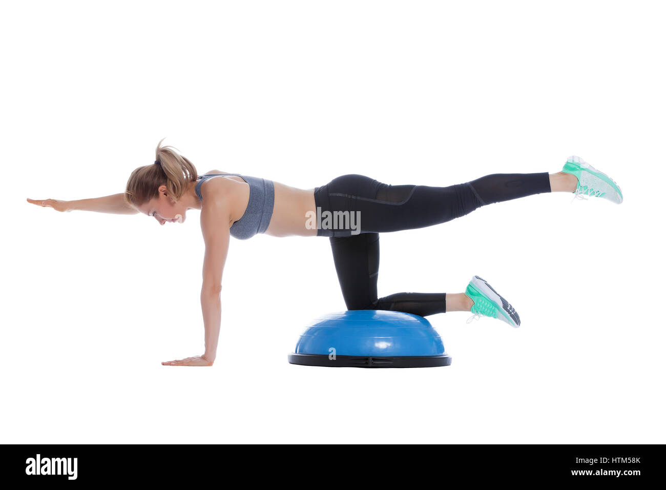 Balance training ball exercise execution with a professional trainer ...