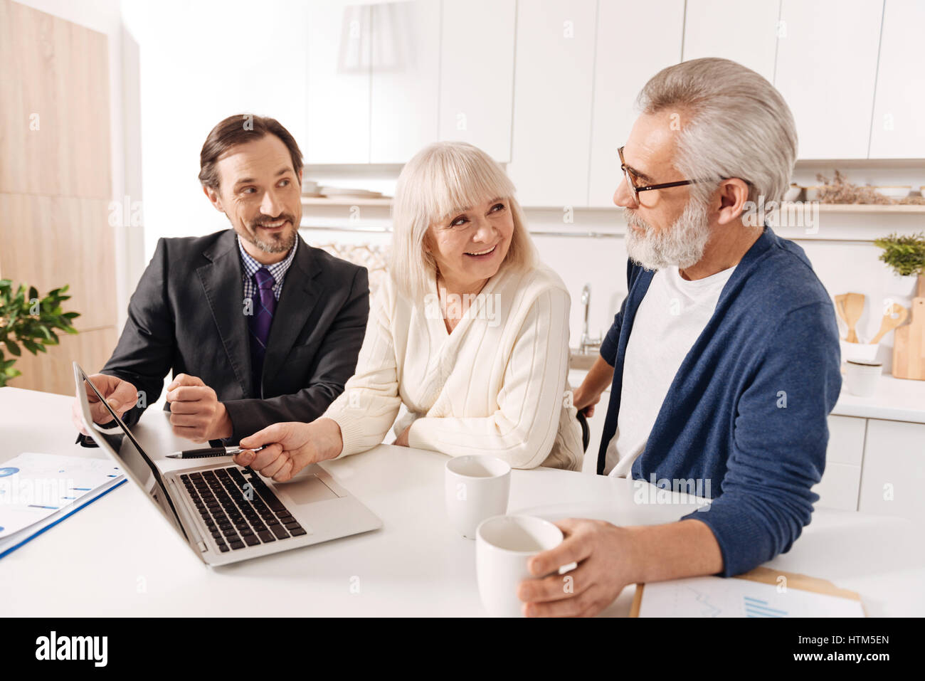 Satisfied lawyer discussing plan of contract with clients Stock Photo ...