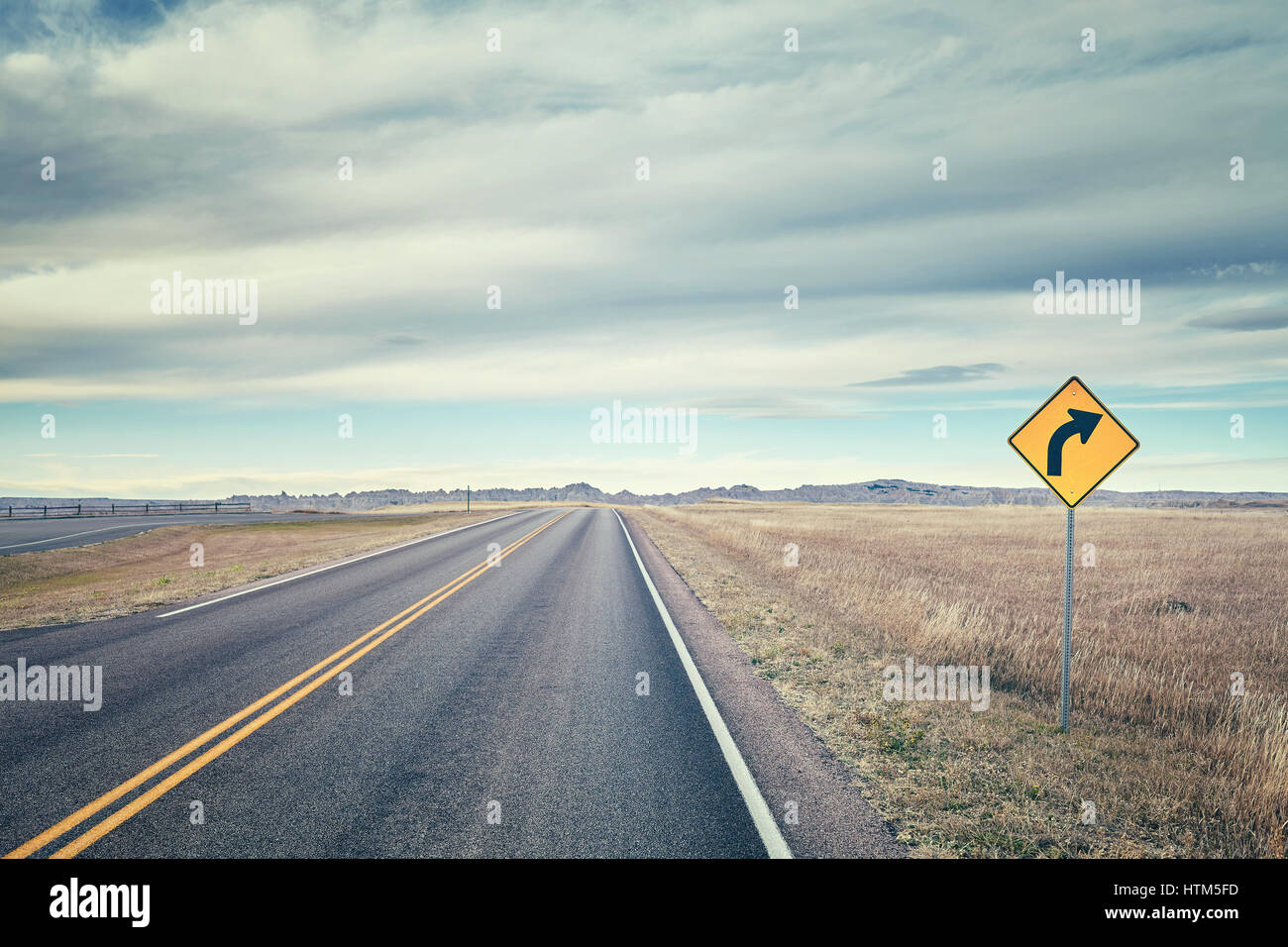 Retro stylized picture of a road with turn sign, USA Stock Photo - Alamy