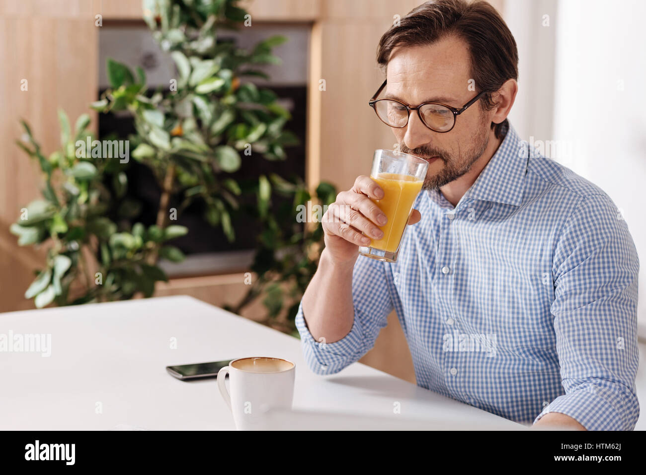 Skilled self employed man working remotely at home Stock Photo - Alamy