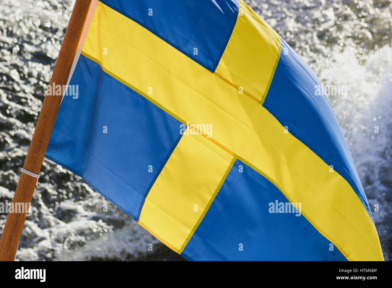 Swedish flag flying from speeding boat, Sweden, Scandinavia Stock Photo ...