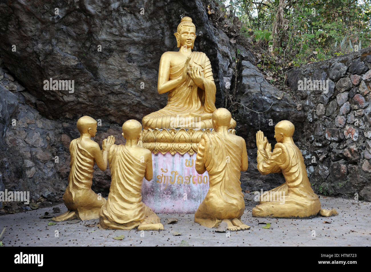 Buddha with monks statues at the Mount Phou Si in Luang Prabang, Laos ...