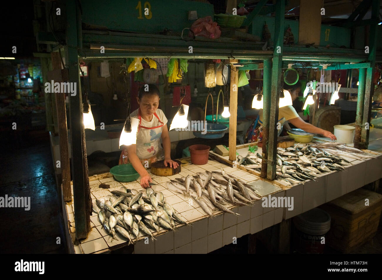 Fish dealer pictured at a local market in Venezuela Stock Photo - Alamy