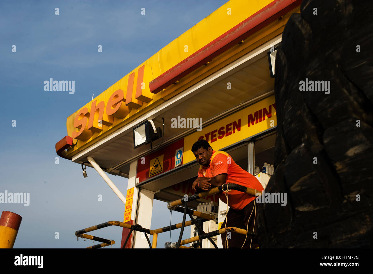 Staff at the Shell petrol station in Brunei Stock Photo - Alamy