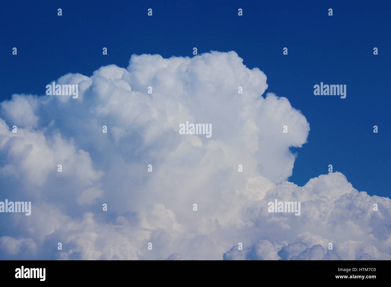 Fluffly clouds in blue sky Stock Photo - Alamy