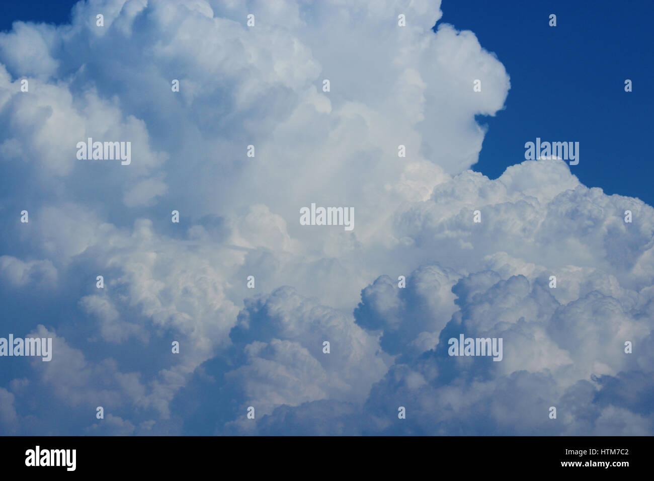 Fluffly clouds in blue sky Stock Photo - Alamy