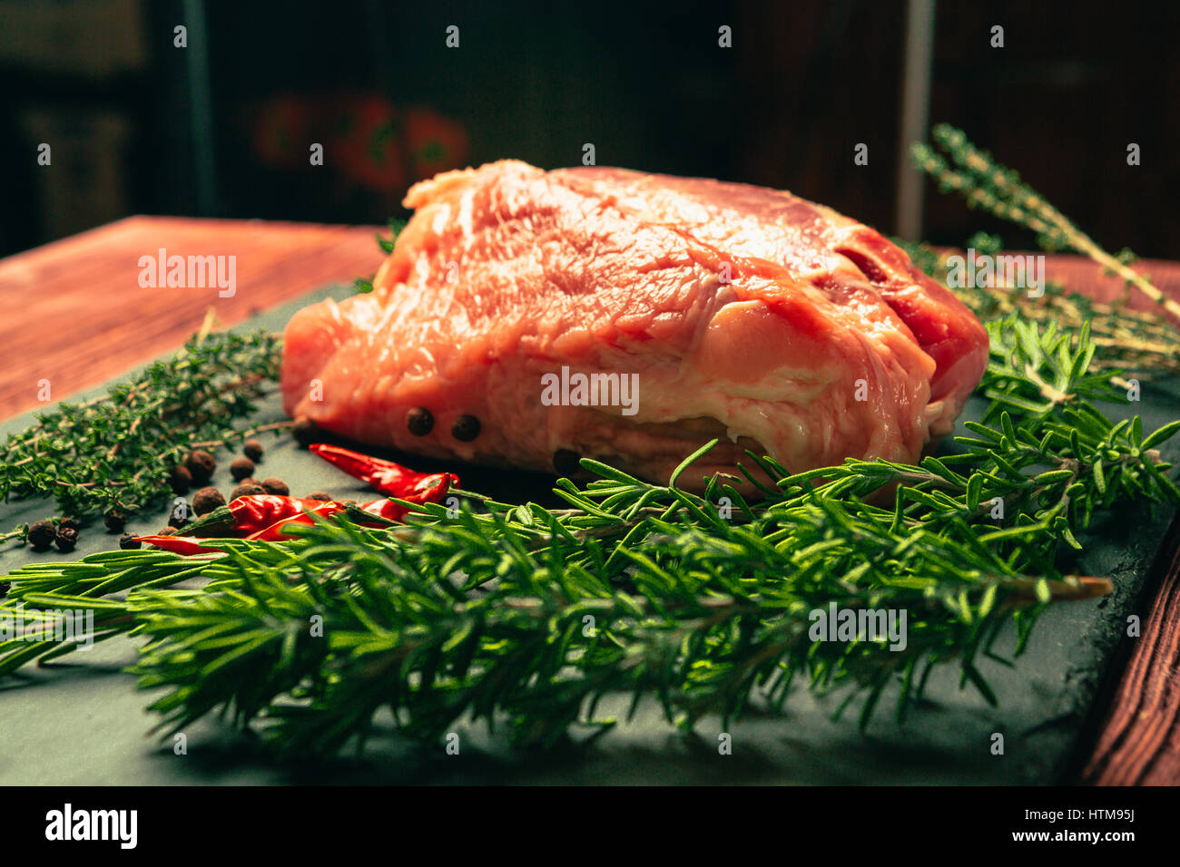 raw pork meat with spices on slate stone kitchen board Stock Photo - Alamy