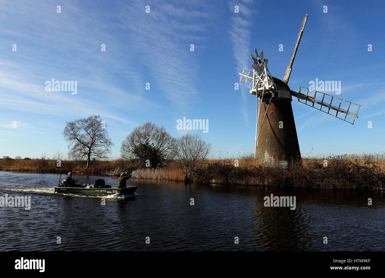 A Broads Authority ranger takes a photo of Turf Fen Mill along the ...