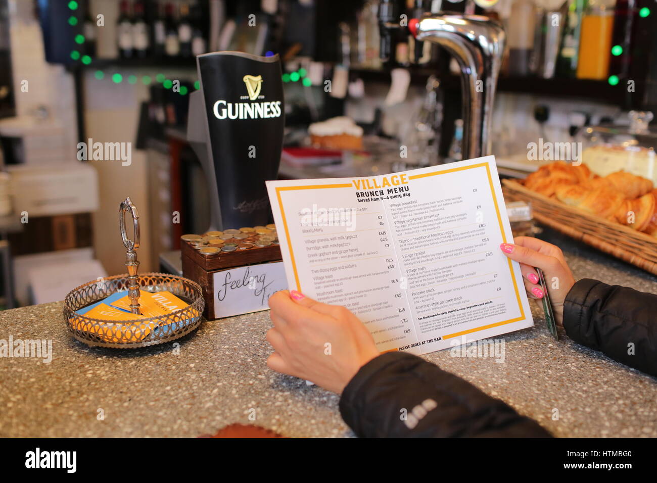 Lady orders food at a Bar Stock Photo - Alamy