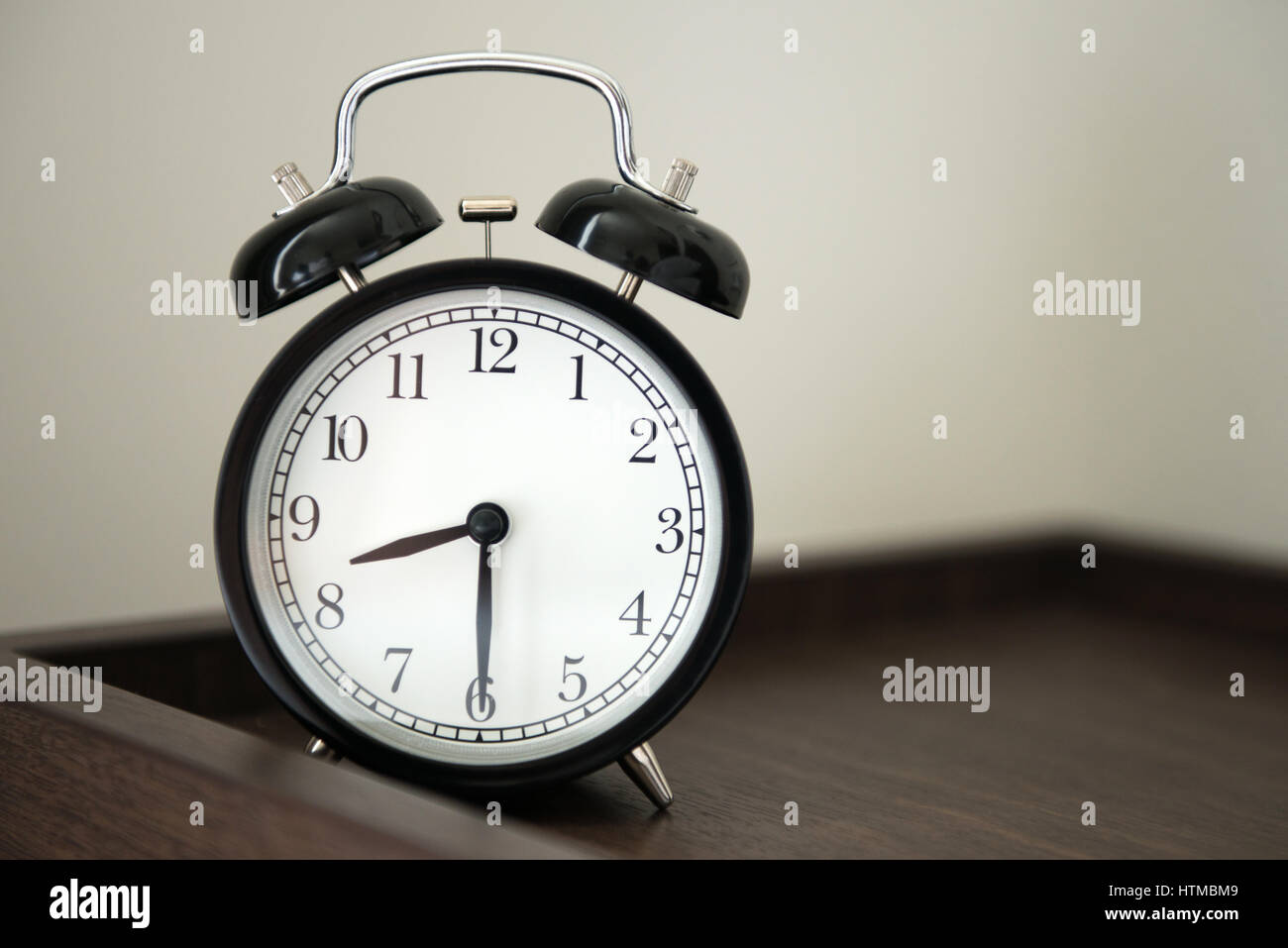alarm clock on bed side table Stock Photo - Alamy
