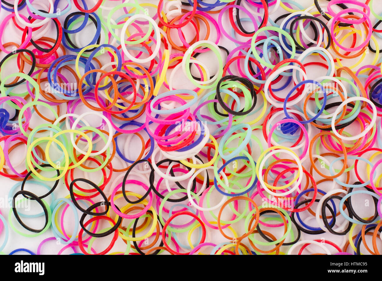 horizontal top view background of many multicolored rubber elastic ...