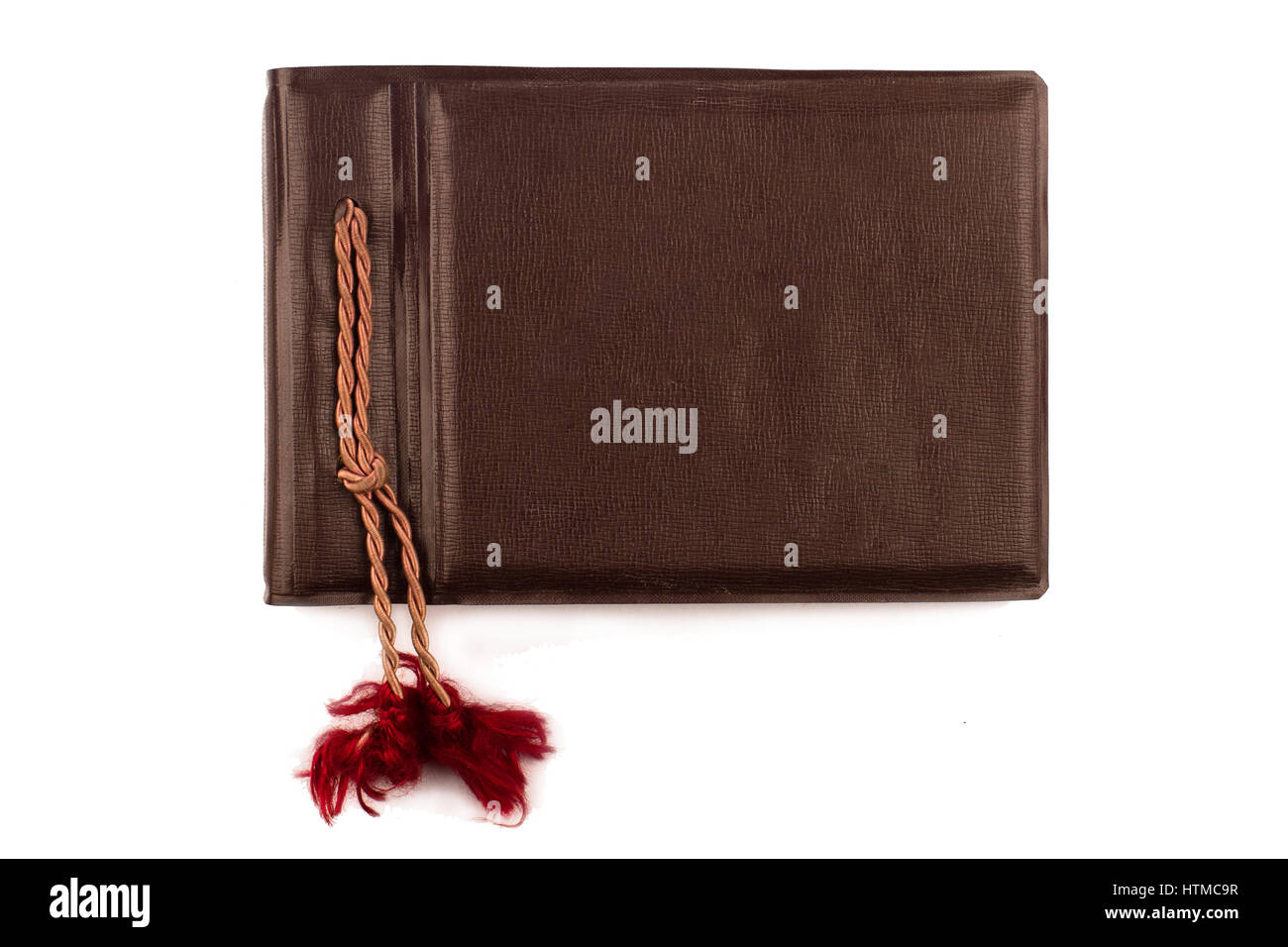 top view of vintage photo brown album cover with rope bindings isolated ...
