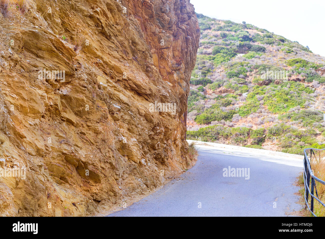 Mountain road, cut through rock. Slice mountain shale, texture of stone ... Mountain road, cut through rock. Slice mountain shale, texture of stone ...