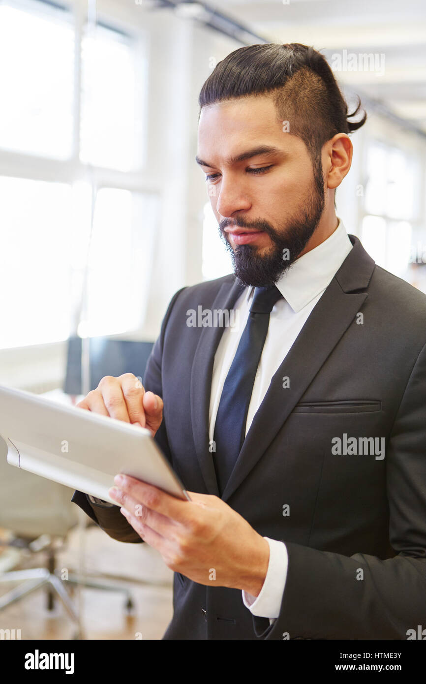 Man as businessman planning with tablet computer Stock Photo - Alamy