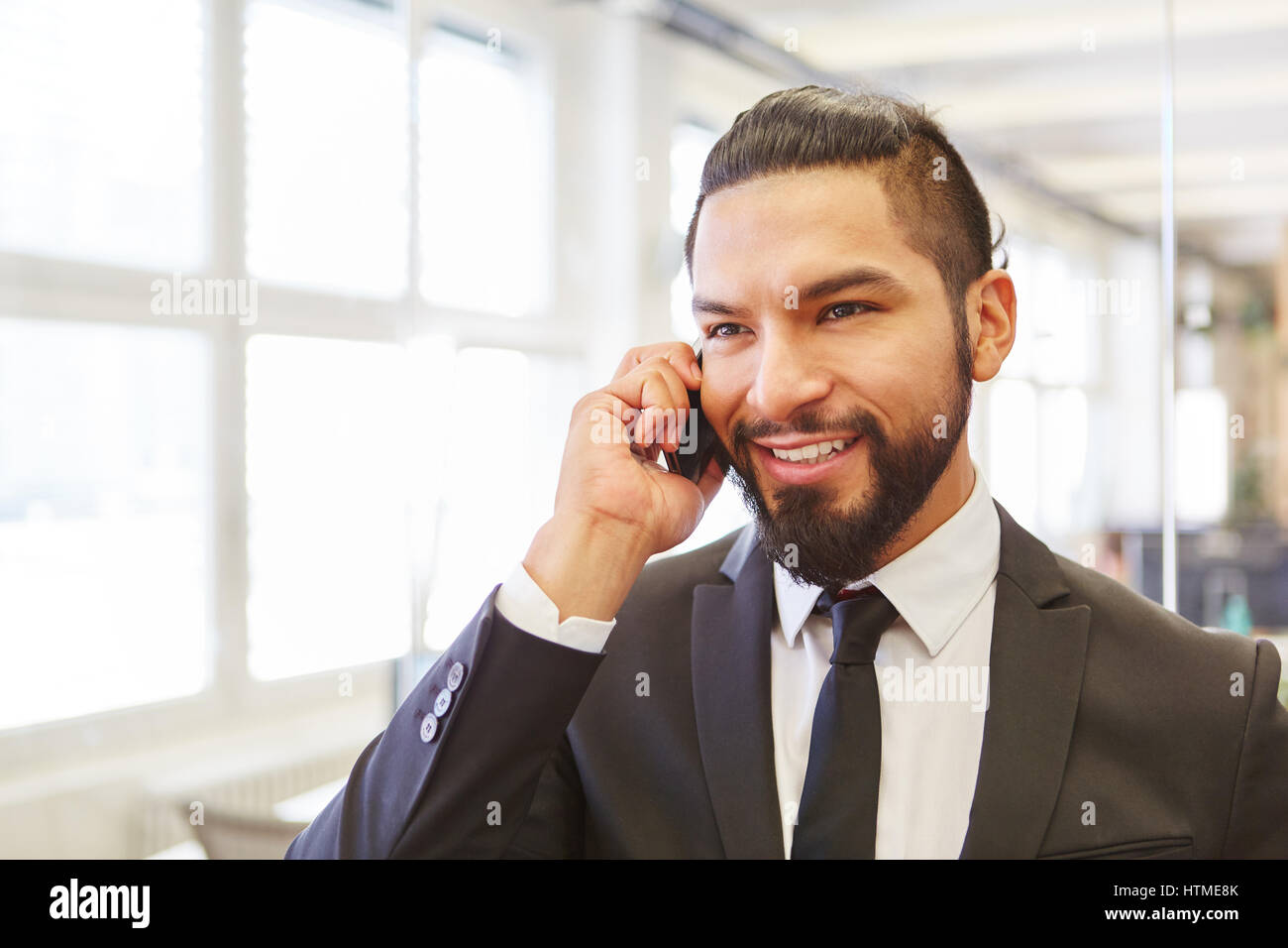 Successful businessman on the phone with smartphone Stock Photo - Alamy