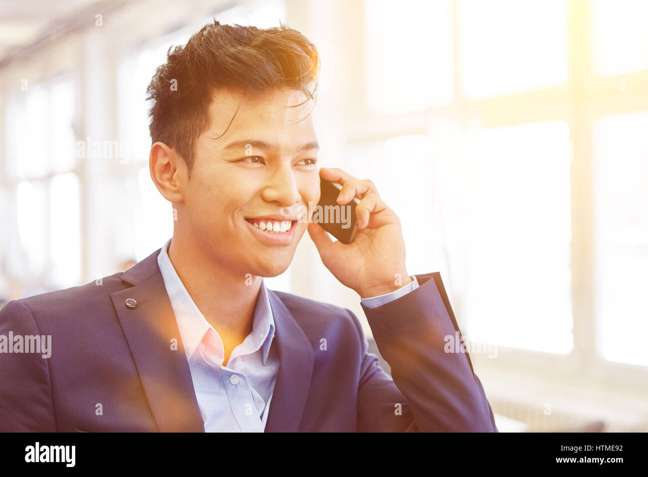 Asian start-up as businessman calling with telephone in the office ...