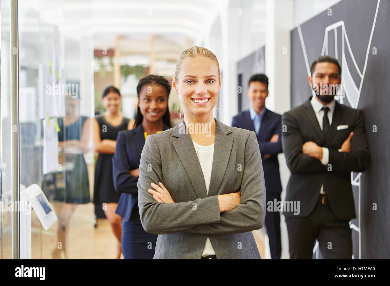 Woman as successful team leader with her team Stock Photo - Alamy