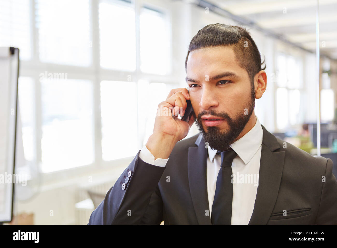 Man as manager in business call at his office Stock Photo - Alamy