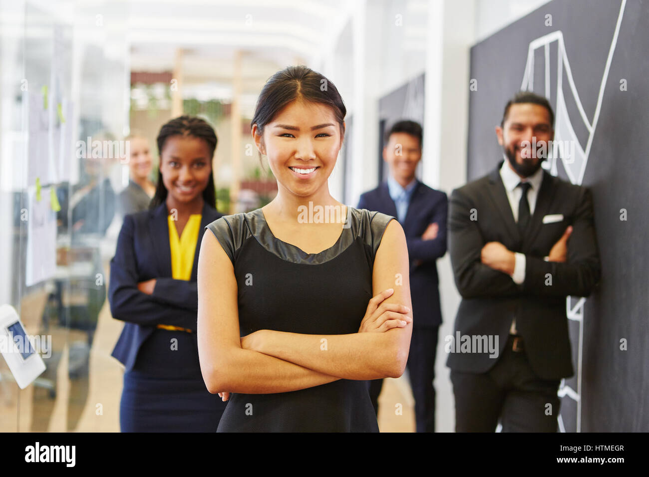 Young asian woman as start-up CEO with her team Stock Photo - Alamy