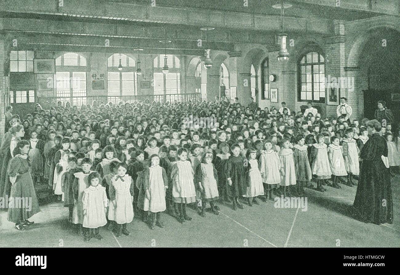 Assembly in a girls' school in the East End of London, 1910 Stock Photo ...