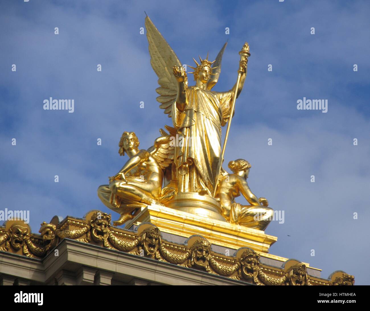 Gilded figure on the top front facade of the Opera Garnier, (Paris ...