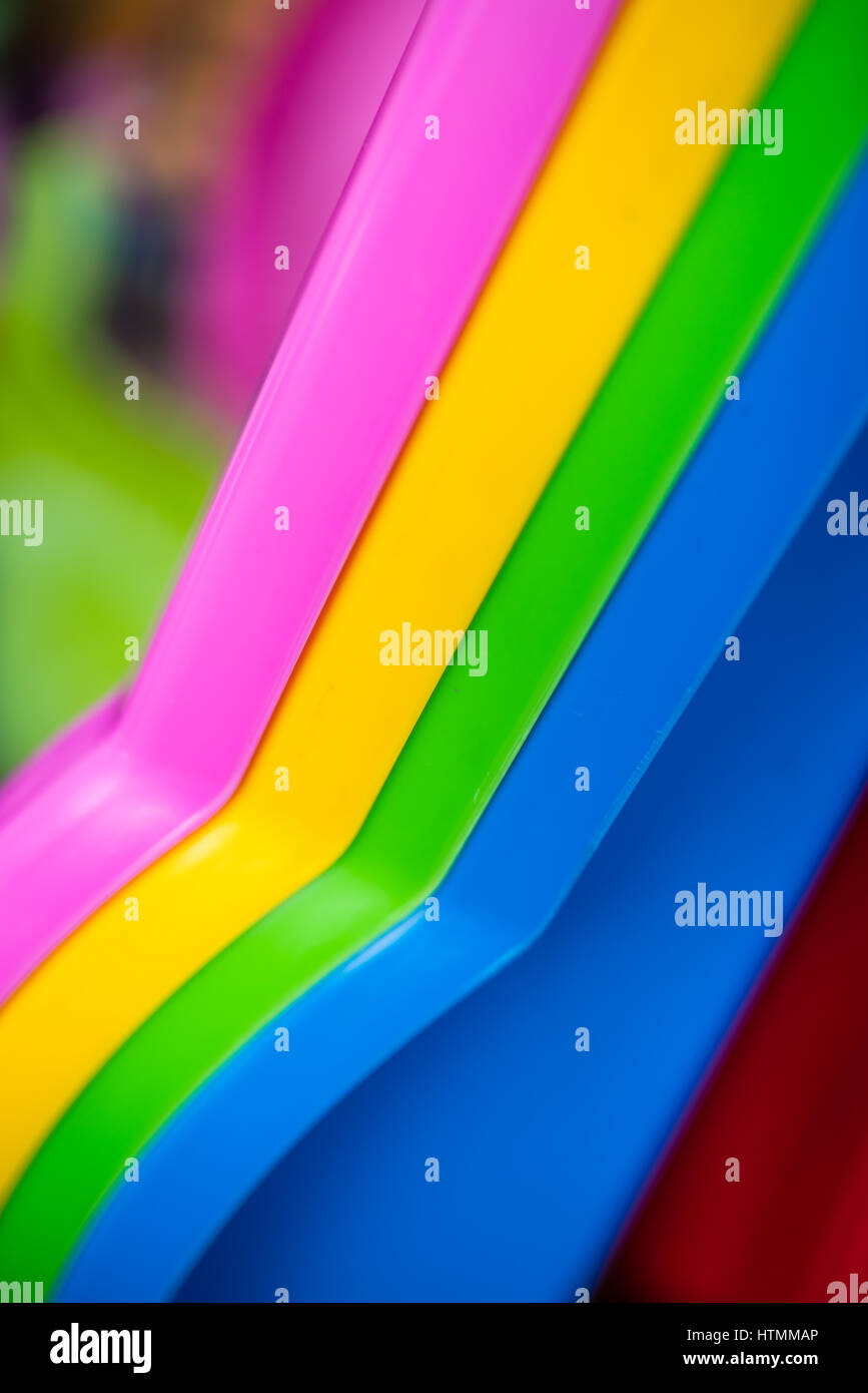 Background of the colorful sides of plastic sleds Stock Photo - Alamy
