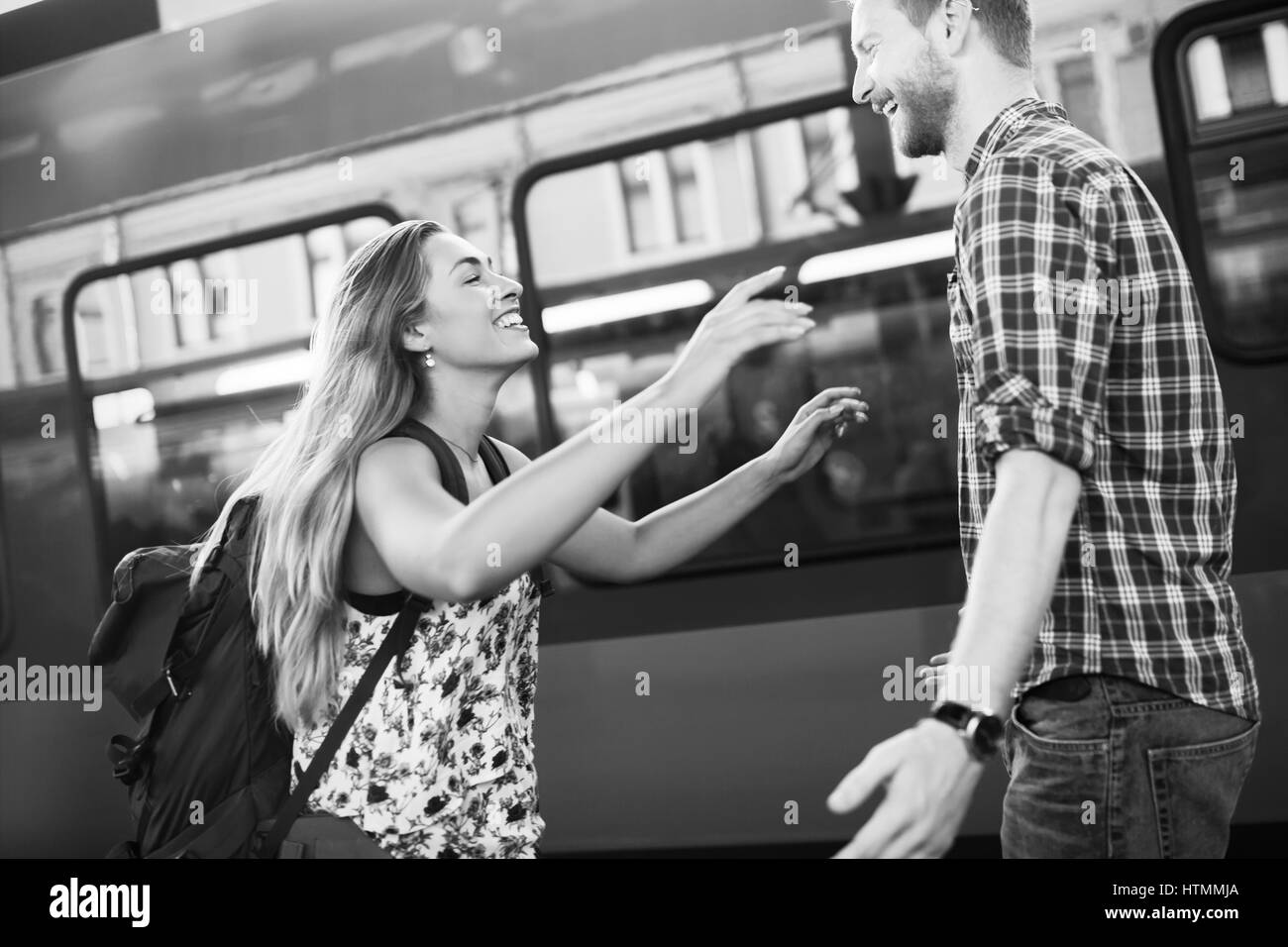 Couple in love reunion after traveler arrives Stock Photo - Alamy