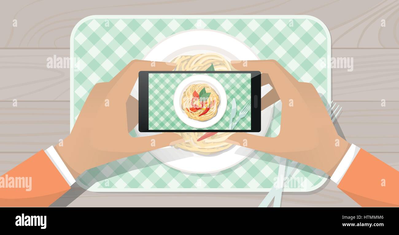 Man taking a picture of his lunch and sharing it online using a touch ...