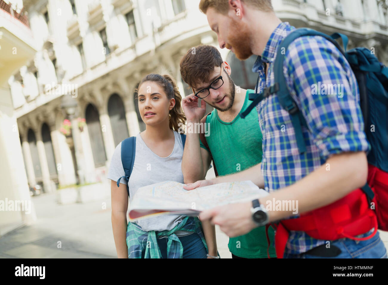 Happy group of students on sightseeing and travel adventure Stock Photo ...