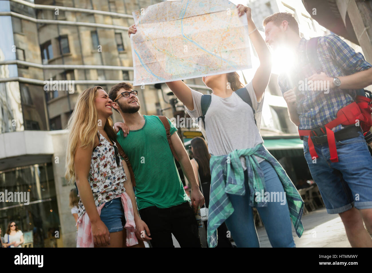 Happy group of tourists traveling and sightseeing together Stock Photo ...