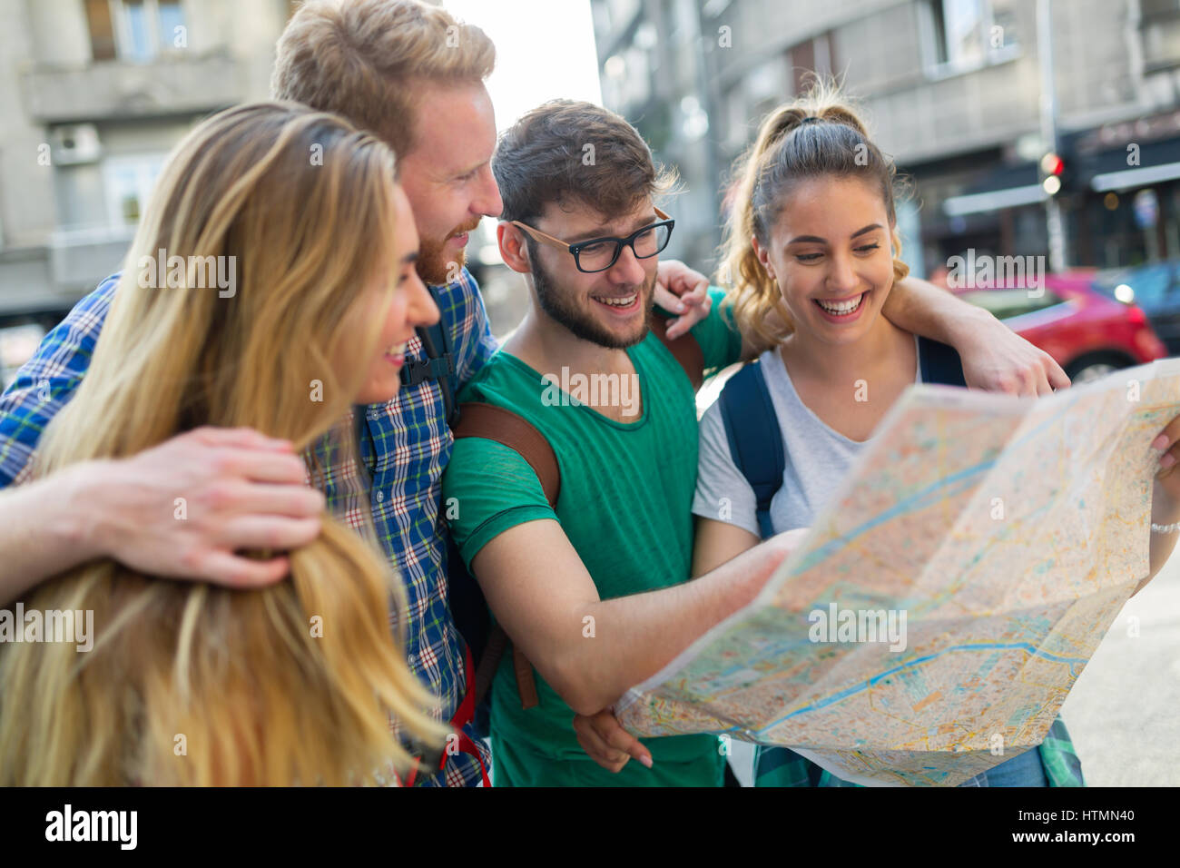 Happy group of tourists traveling and sightseeing together Stock Photo ...