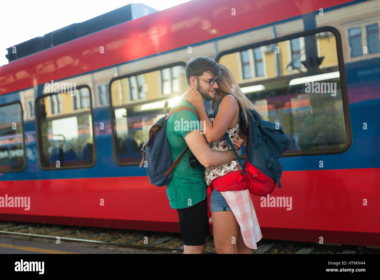 Couple in love reunion after traveler arrives Stock Photo - Alamy
