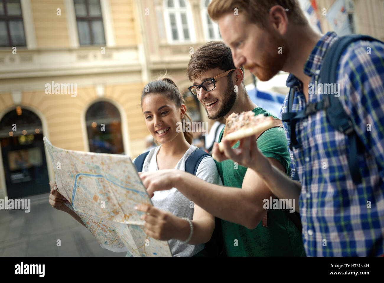 Tourist group of friends discovering city on foot and travelling Stock ...