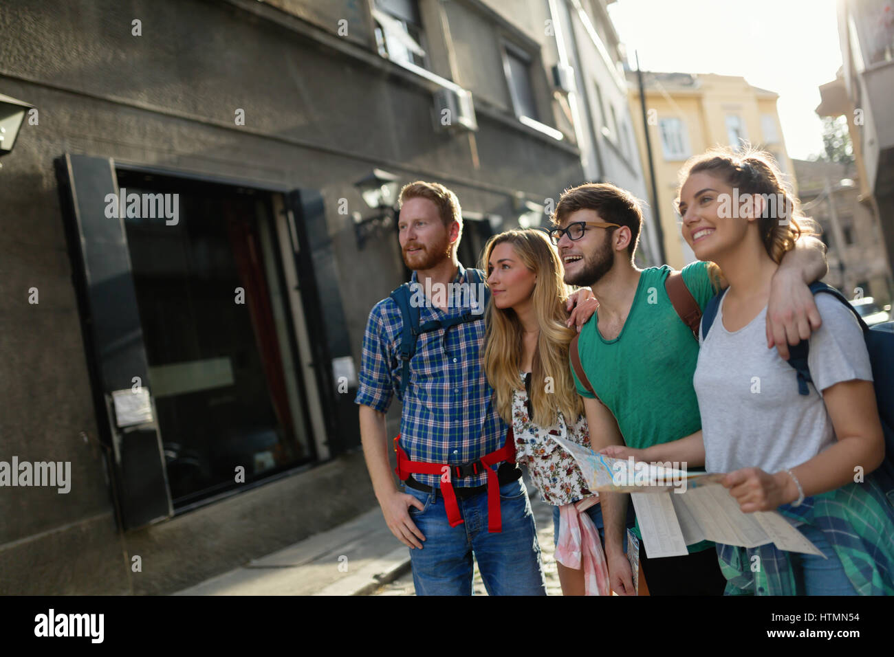 Happy young students on a travelling adventure Stock Photo - Alamy