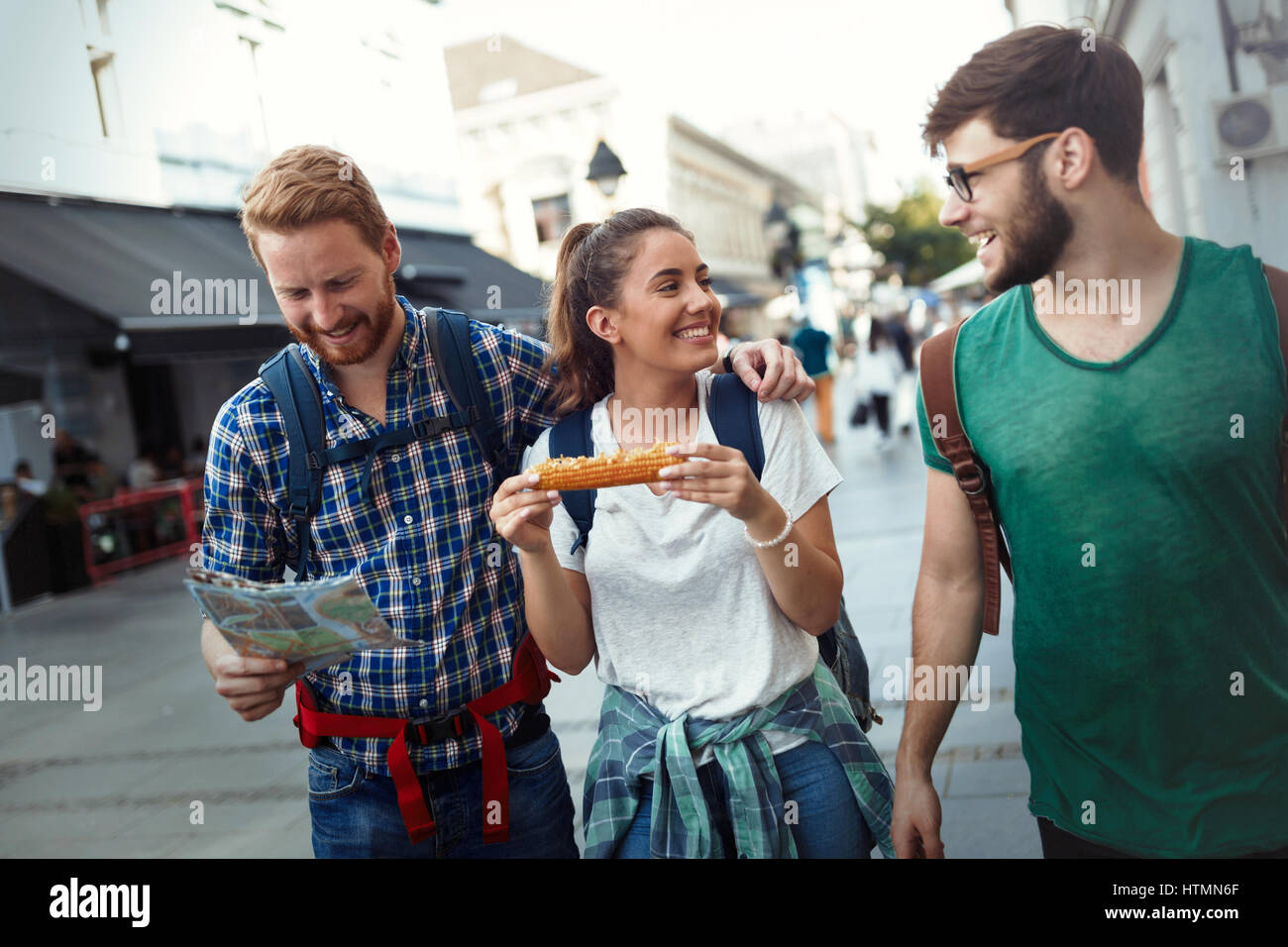 Young travelling people having fun and sightseeing in city Stock Photo ...
