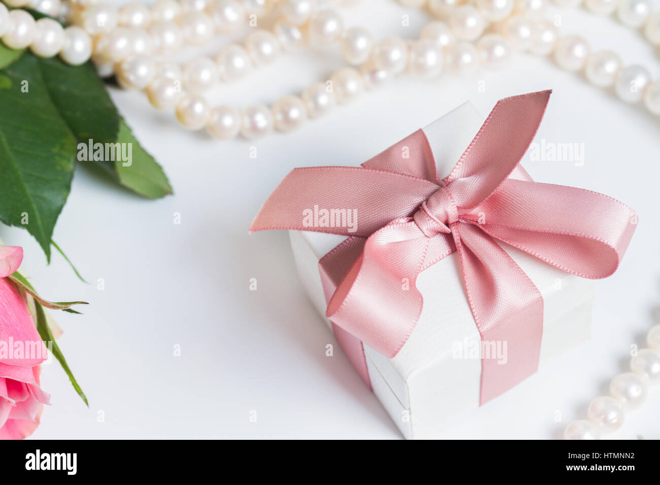 Box with pink ribbon Stock Photo - Alamy