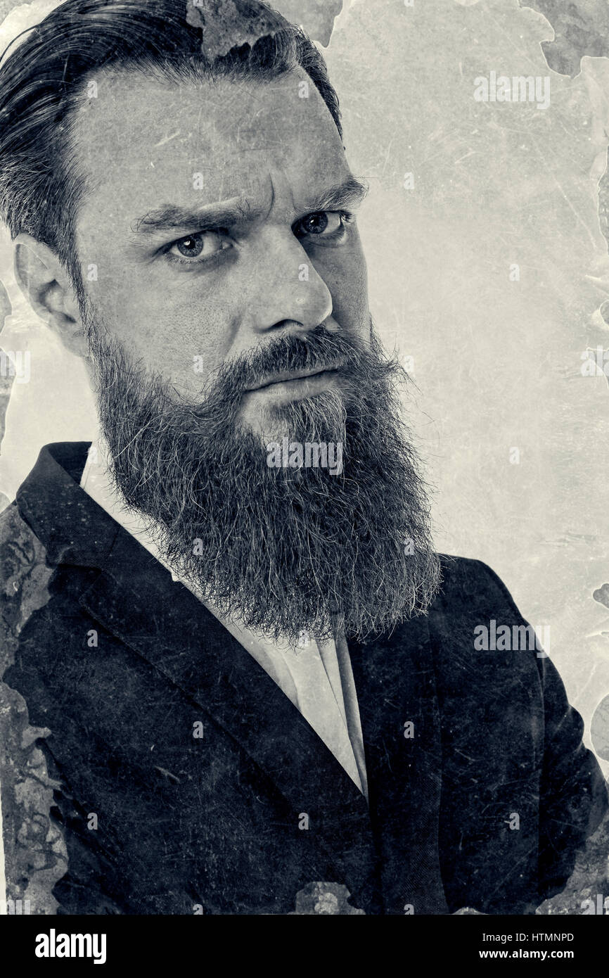 Portrait of a young confident bearded man.Old style Stock Photo - Alamy