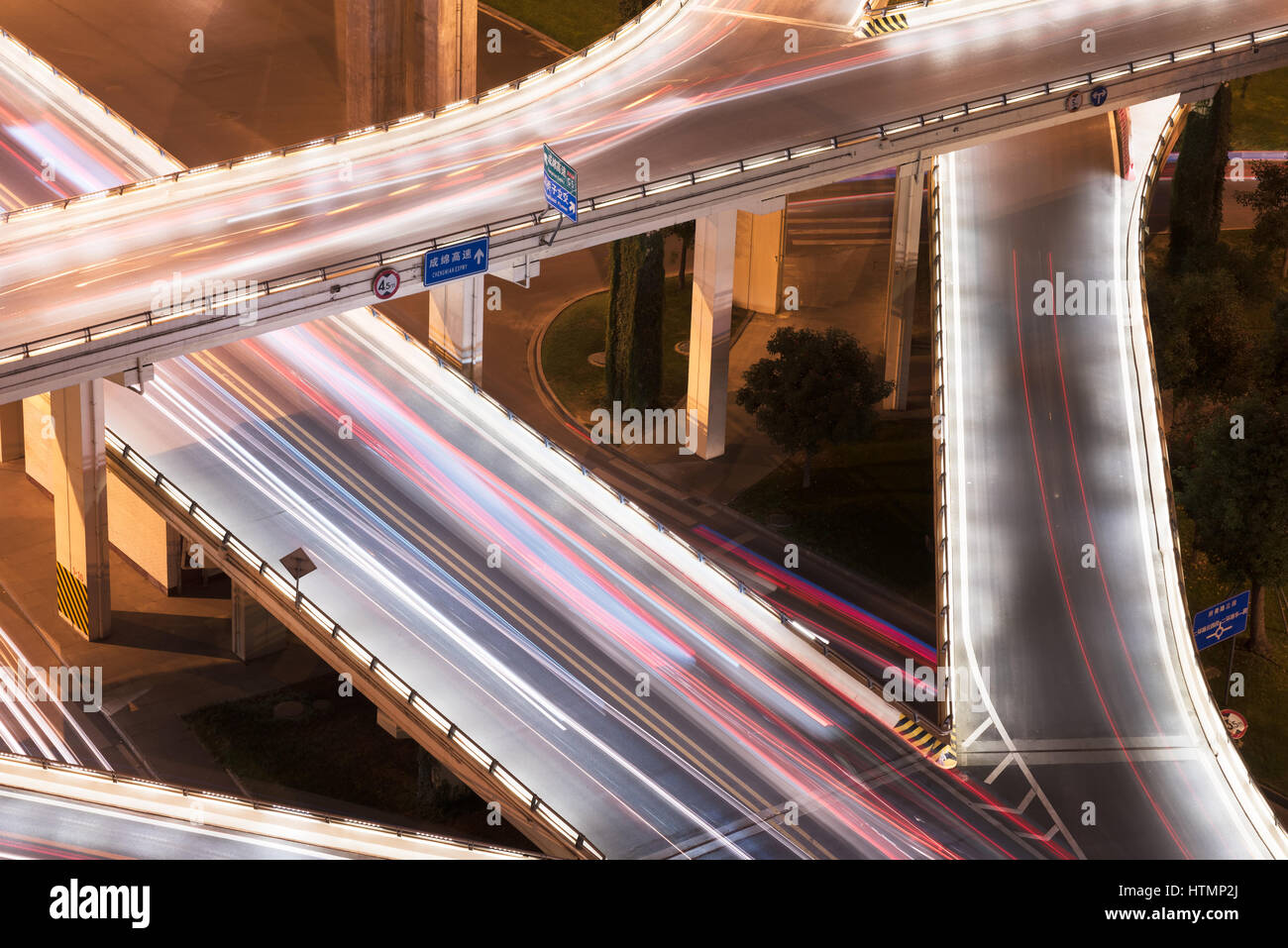 Car traffic on a flyover crossing road at night in Chengdu city Stock ...