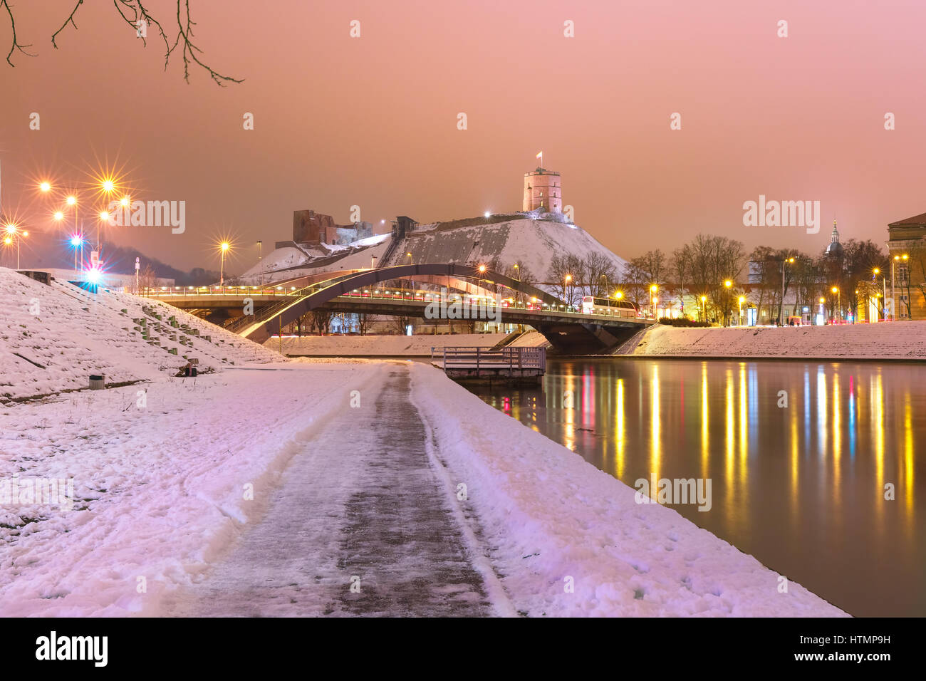 Night Gediminas Tower and King Mindaugas Bridge across Neris River in ...