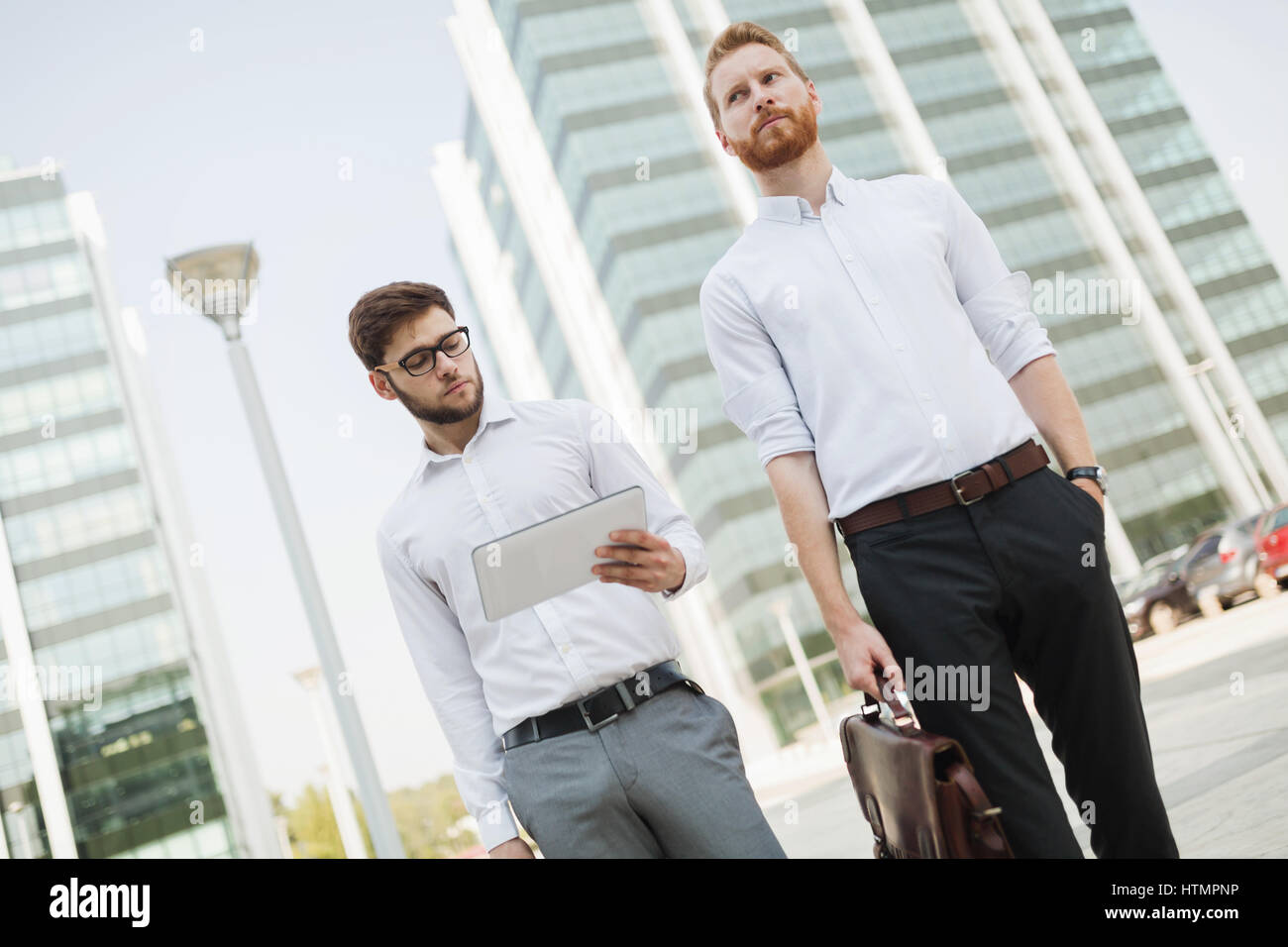 Business people going to work and carrying smart technology Stock Photo ...