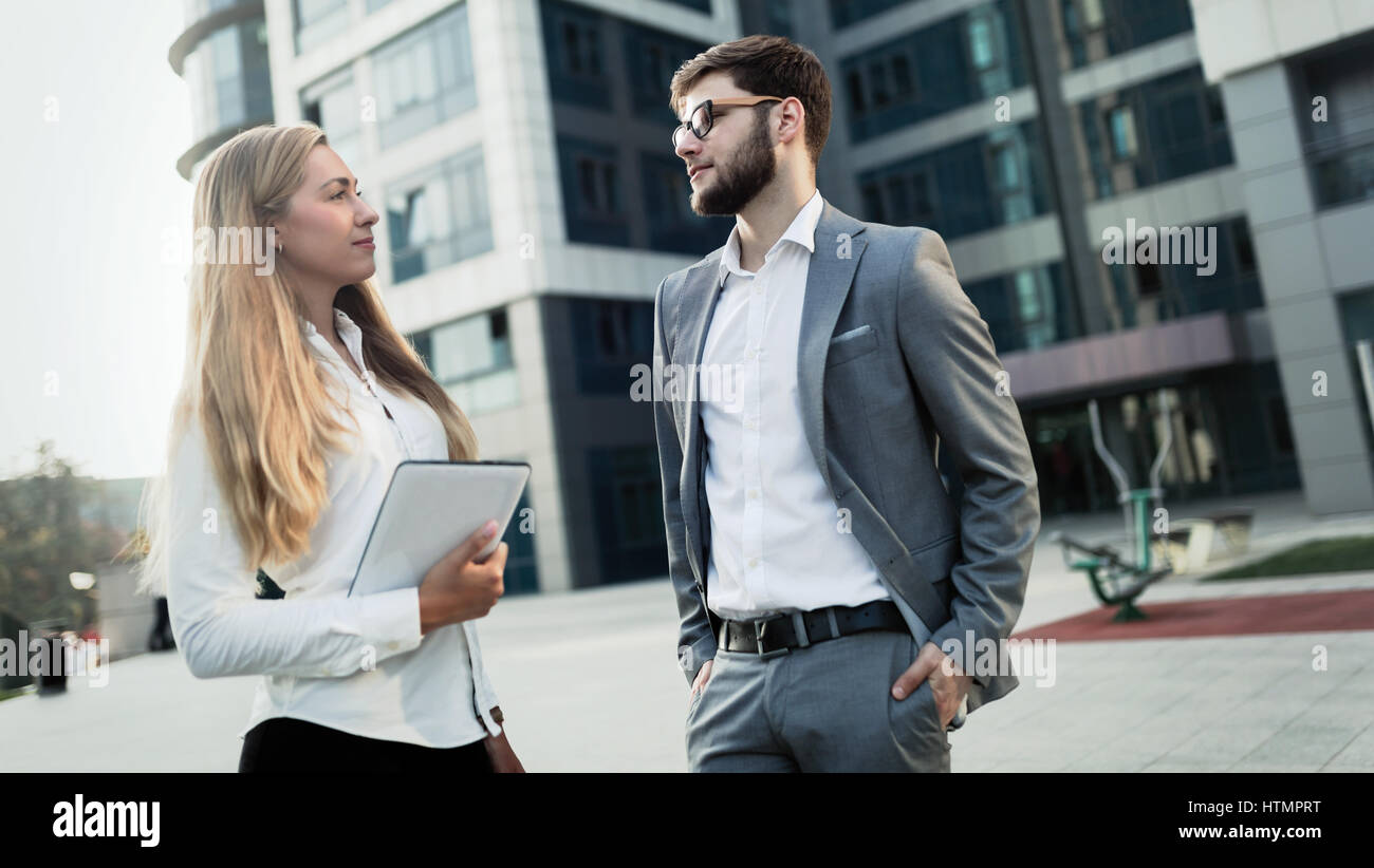 Business people commuting on street and talking Stock Photo - Alamy